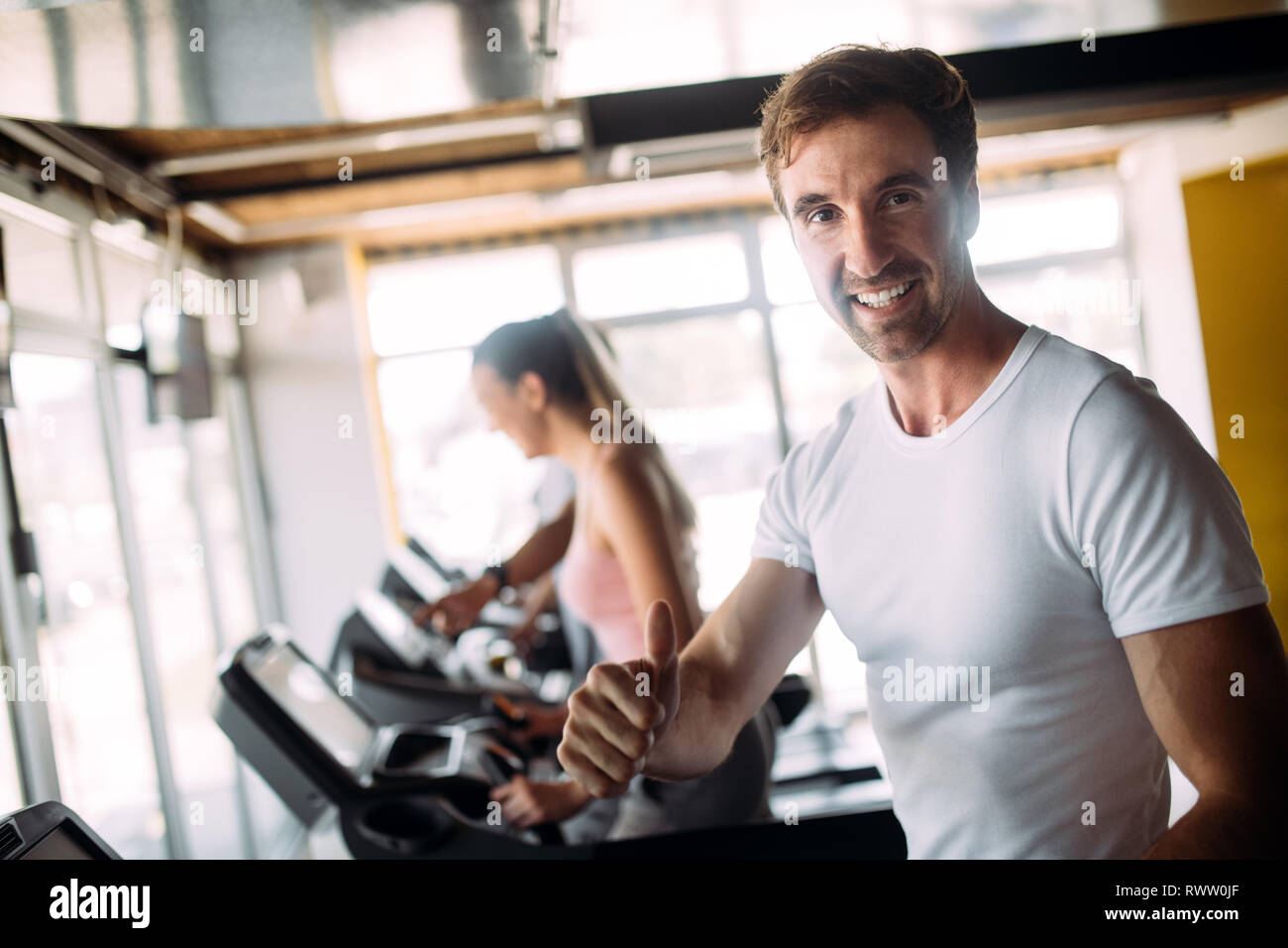 Group of healthy fit people at the gym exercising Stock Photo - Alamy