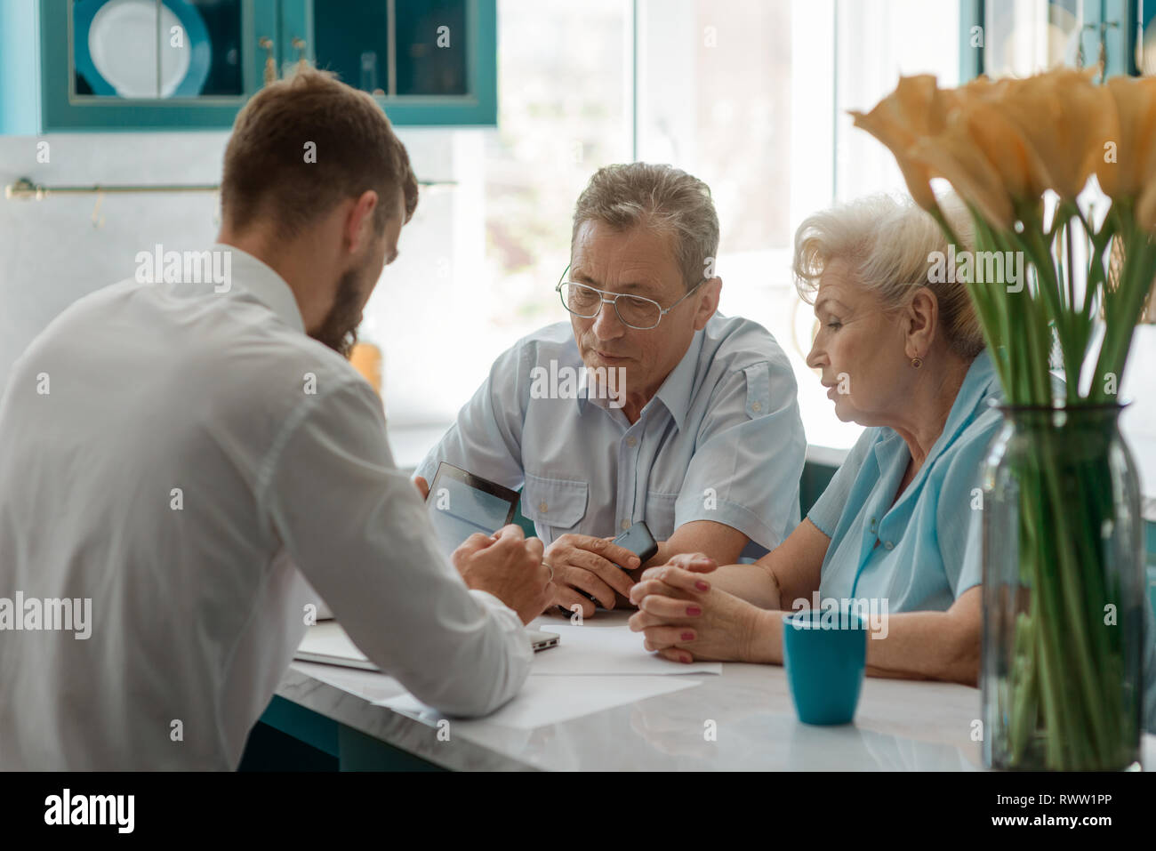 Senior couple taking a risk and making a hard decision while talking ...