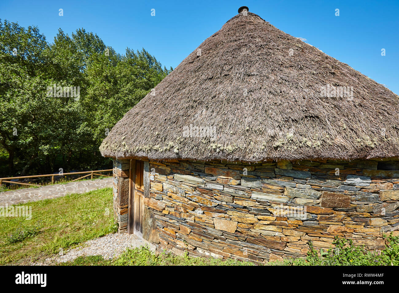 Traditional spanish construction made with stones and conical roof ...