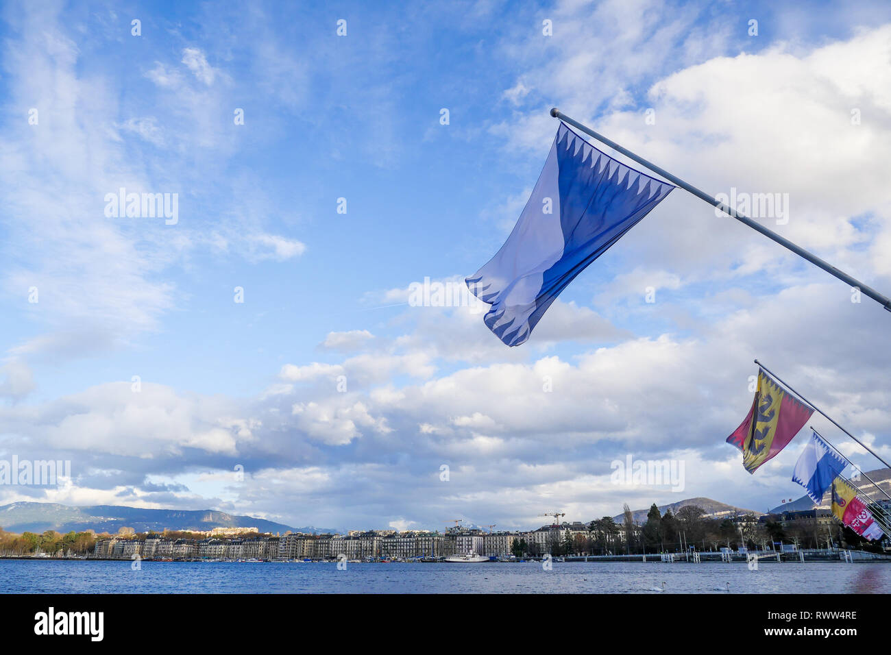 Flags of Swiss cantons fly in the wind, Mont-Blanc Bridge, Geneva ...