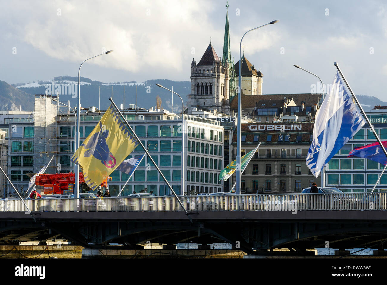 Flags of Swiss cantons fly in the wind, Mont-Blanc Bridge, Geneva ...