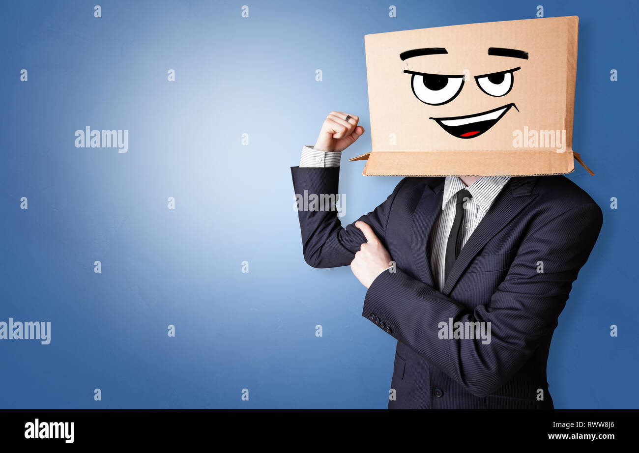 Young man with happy face illustrated cardboard box on his head Stock ...