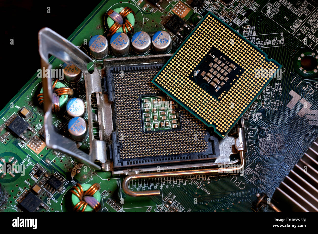 Computer mother board and CPU in filthy conditions after use in an ...