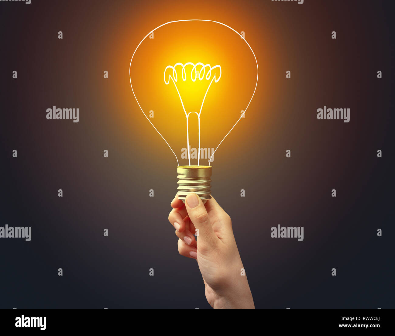 Hand holding light bulb on dark background, new idea concept Stock Photo - Alamy