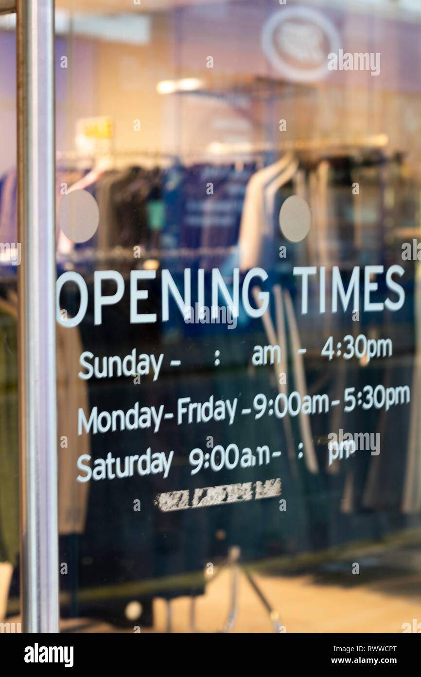 Sign opening times clothing hi-res stock photography and images - Alamy