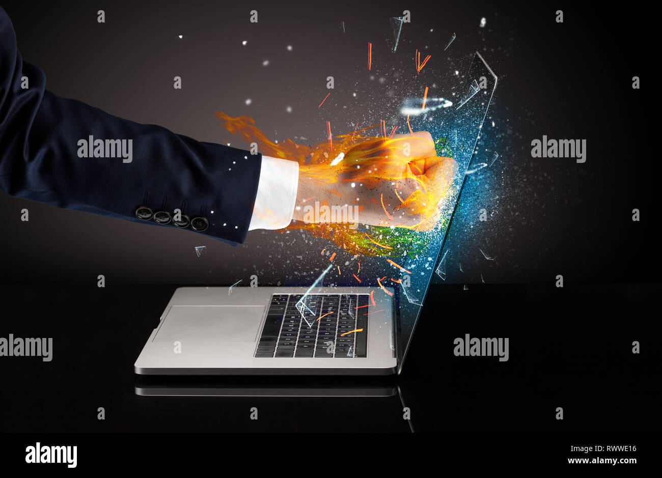 Firing hand hitting strongly laptop screen glass Stock Photo - Alamy