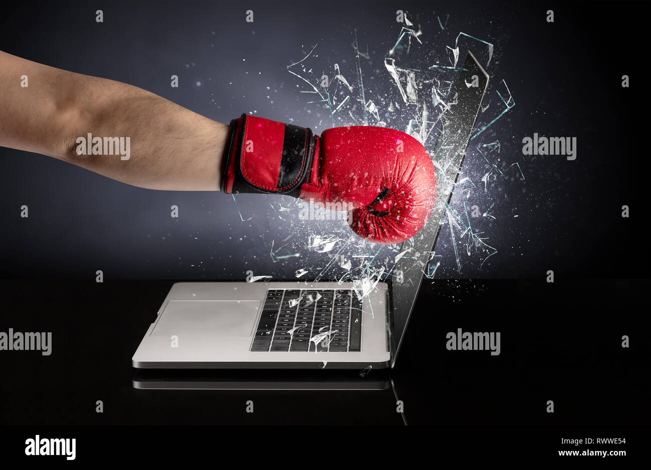 Hand hitting strongly laptop screen glass Stock Photo - Alamy