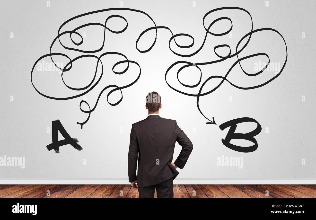 Businessman looking for connection between two things while standing in ...