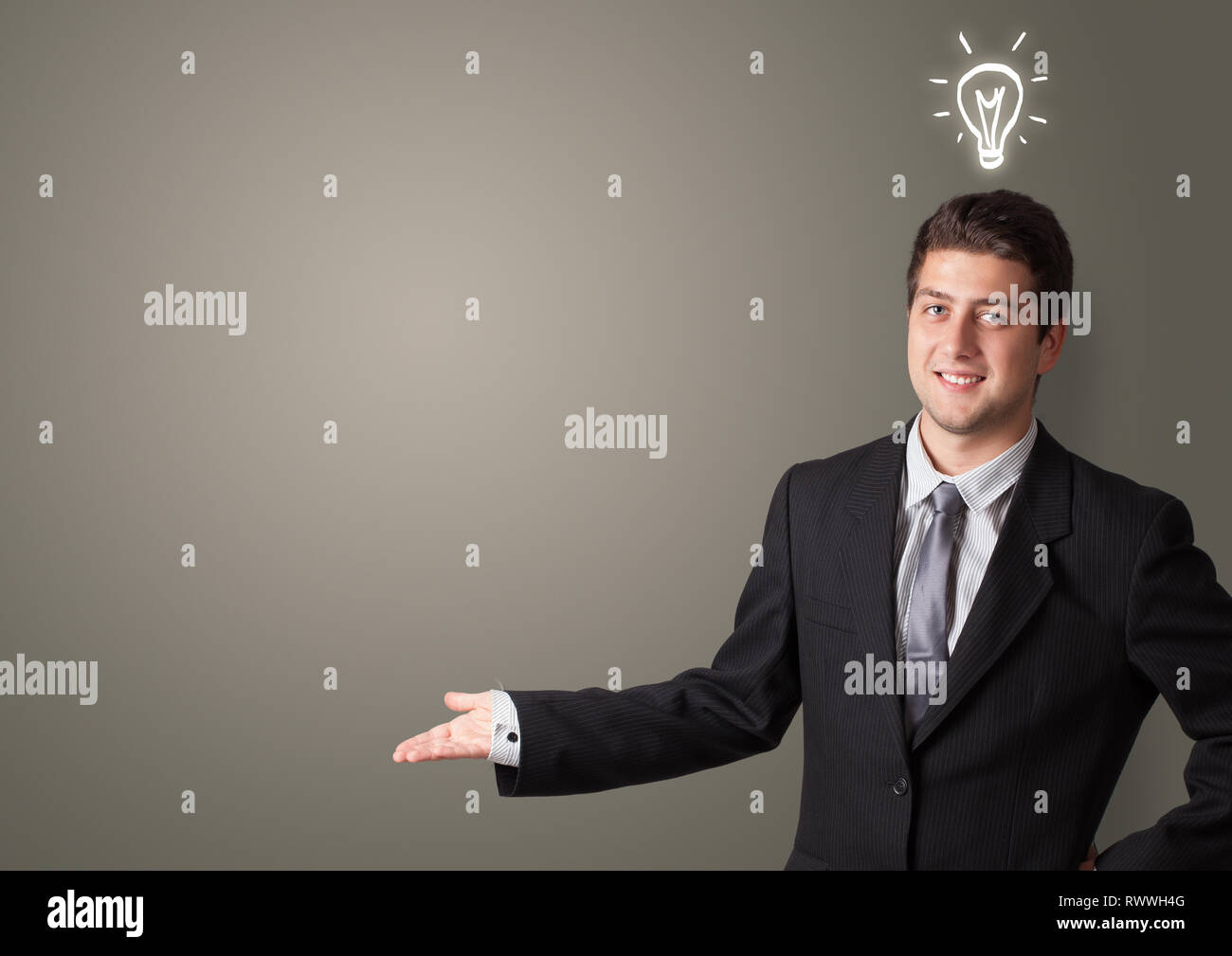 Young smiling person presenting new idea concept Stock Photo - Alamy
