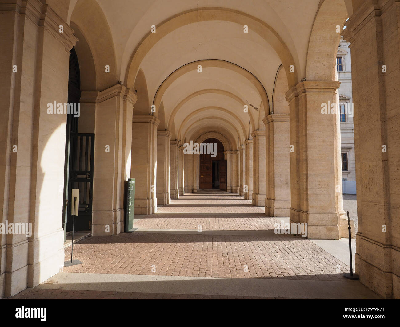 Exterior arched corridor or entrance to National Gallery of Ancient Art ...