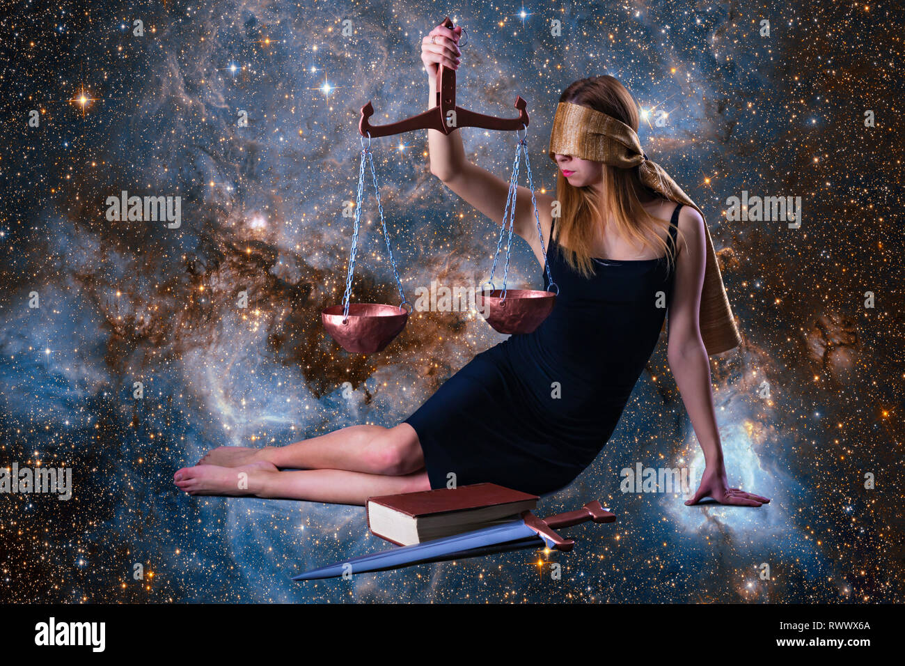 Zodiac sign Libra, presented by a beautiful girl among space galaxies ...