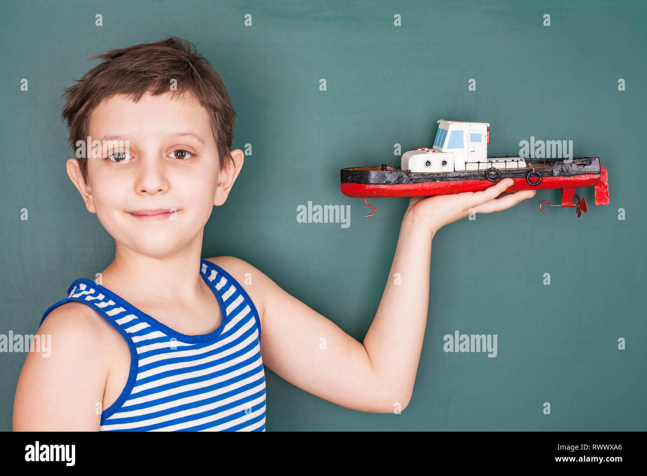 Schoolboy with his own hand built model boats Stock Photo - Alamy