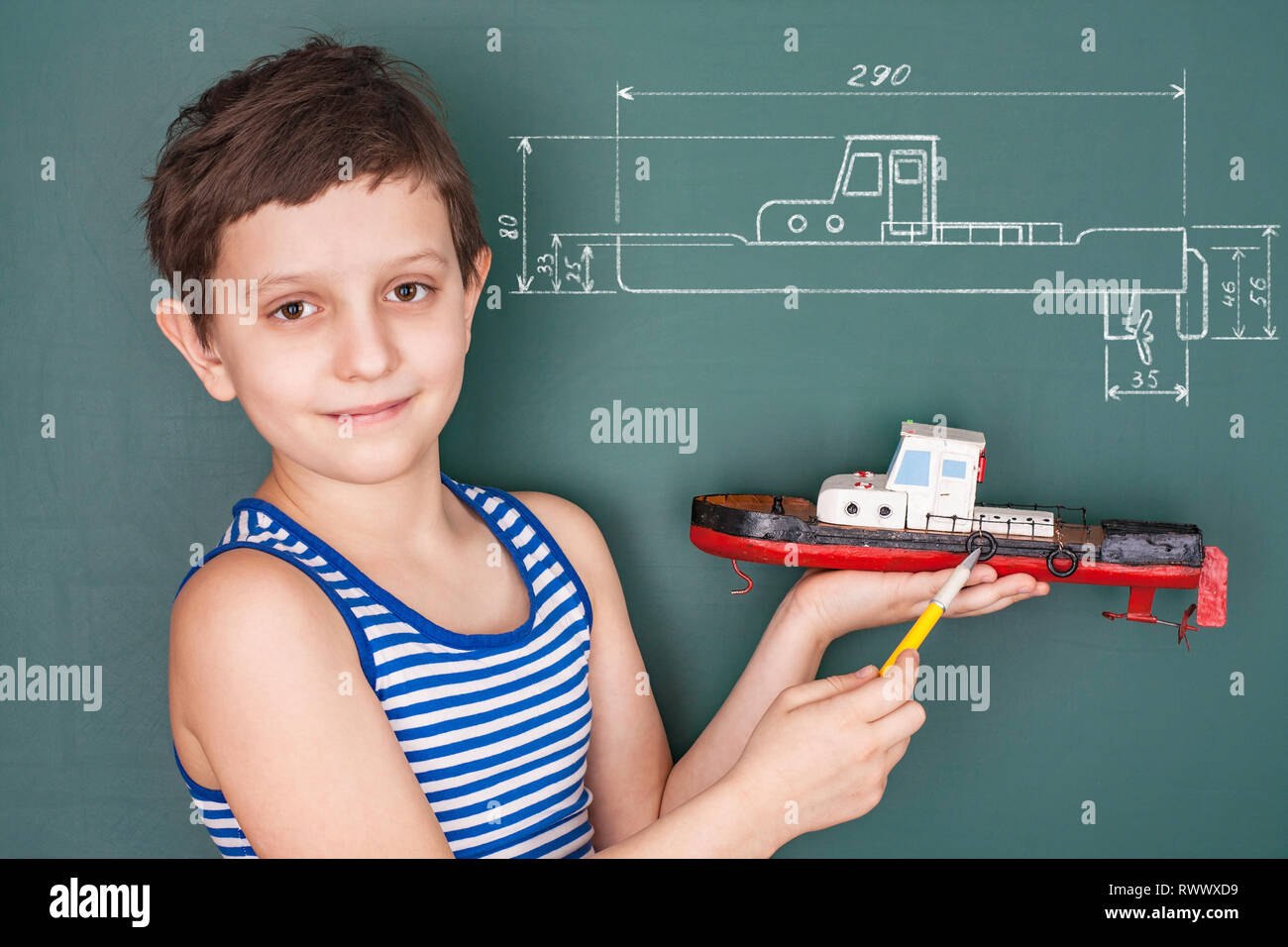Schoolboy with his own hand built model boats Stock Photo - Alamy