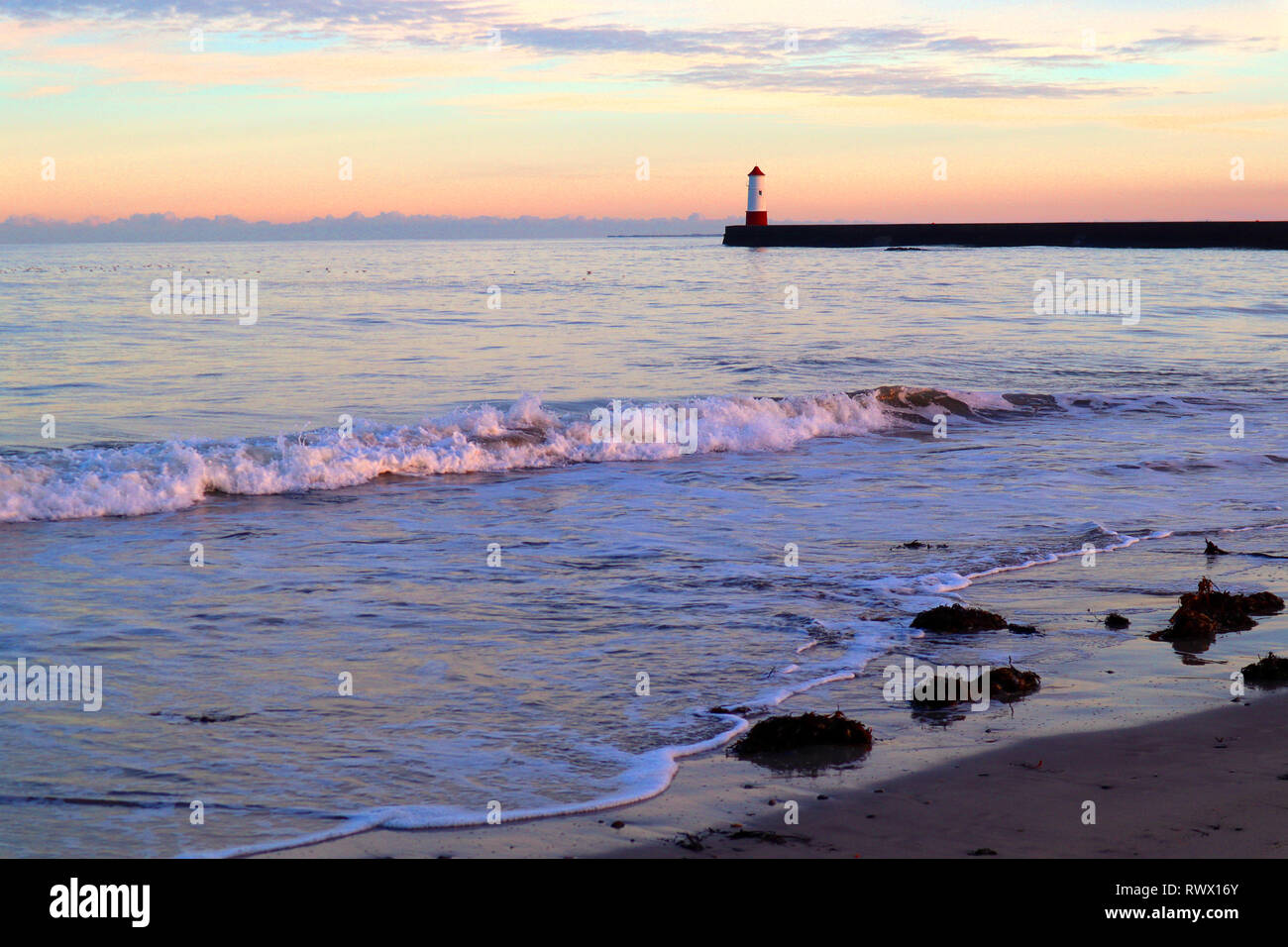 A Lighthouse at Sunset Stock Photo - Alamy