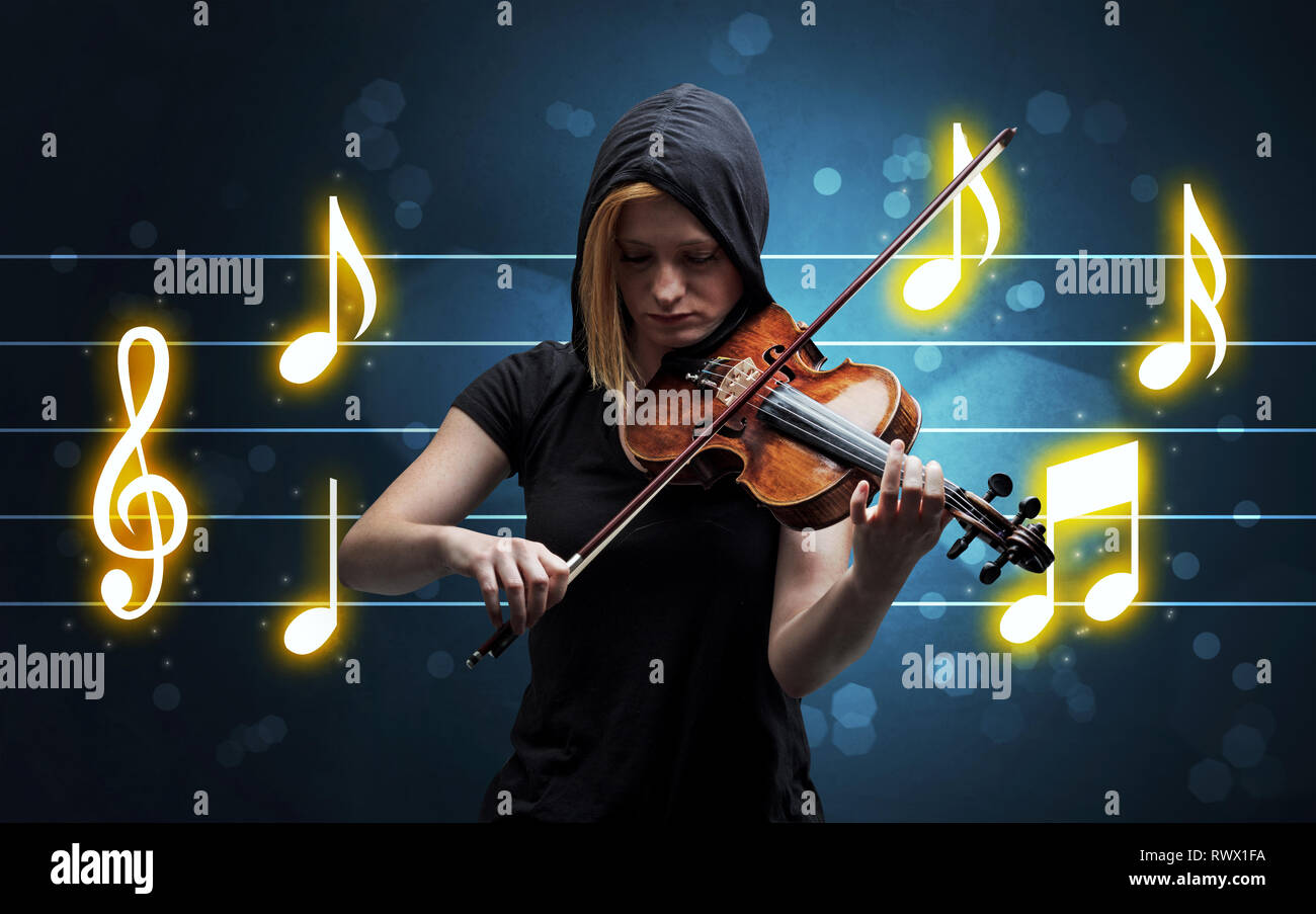 Young handsome fiddler playing with music sheet background Stock Photo ...