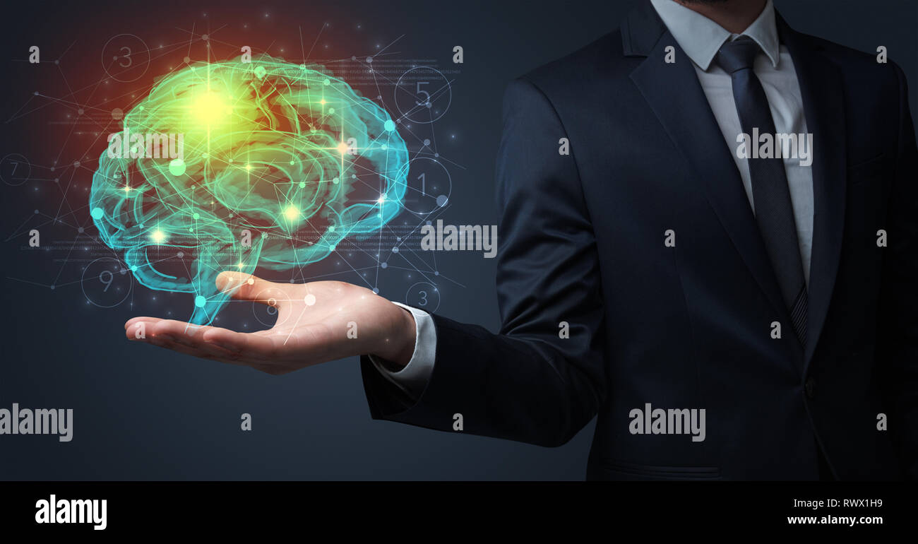 Businessman holding human brain on his hand with logistics symbols ...