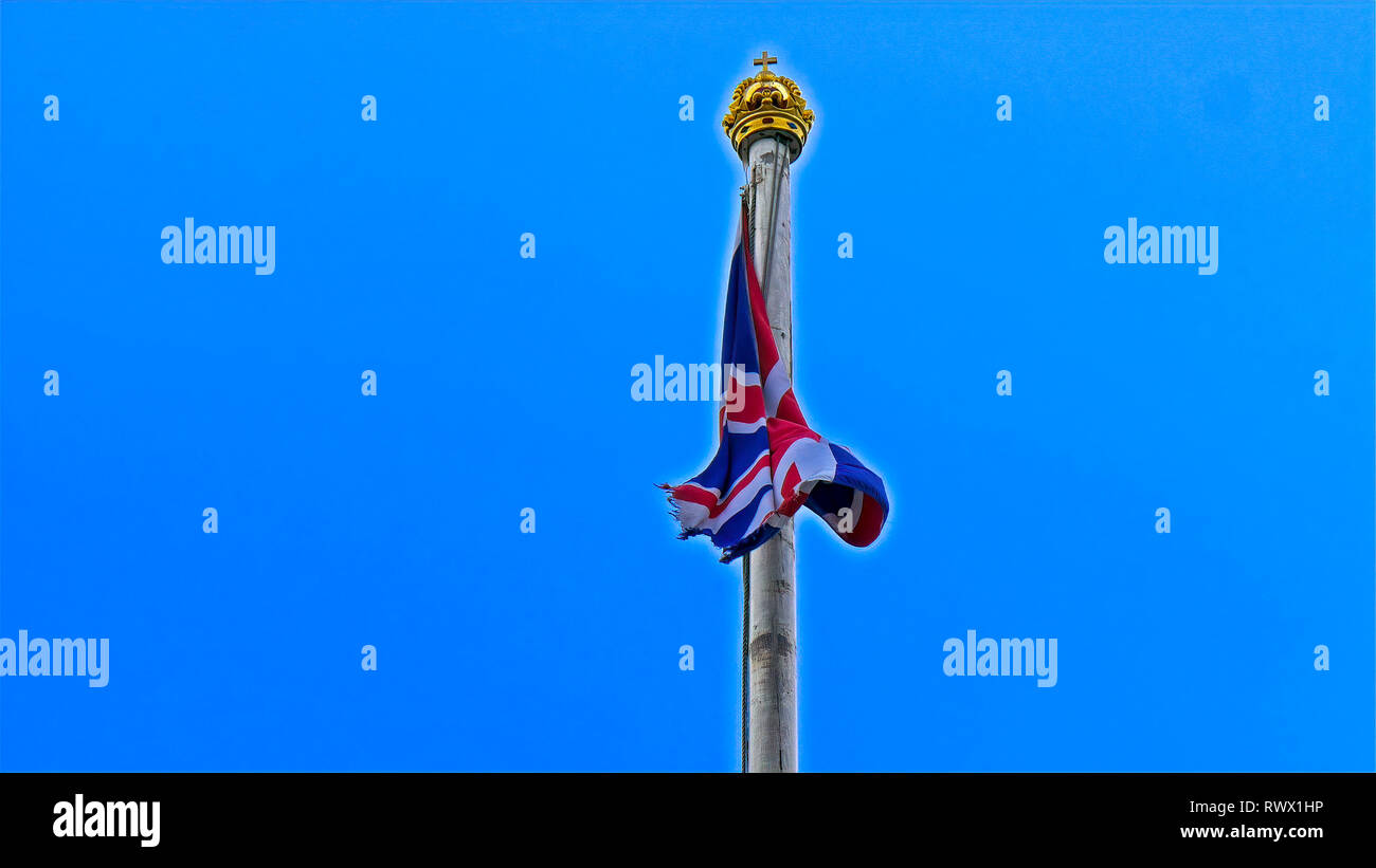 The flag pole with the golden crown in Buckingham Palace. There is an ...