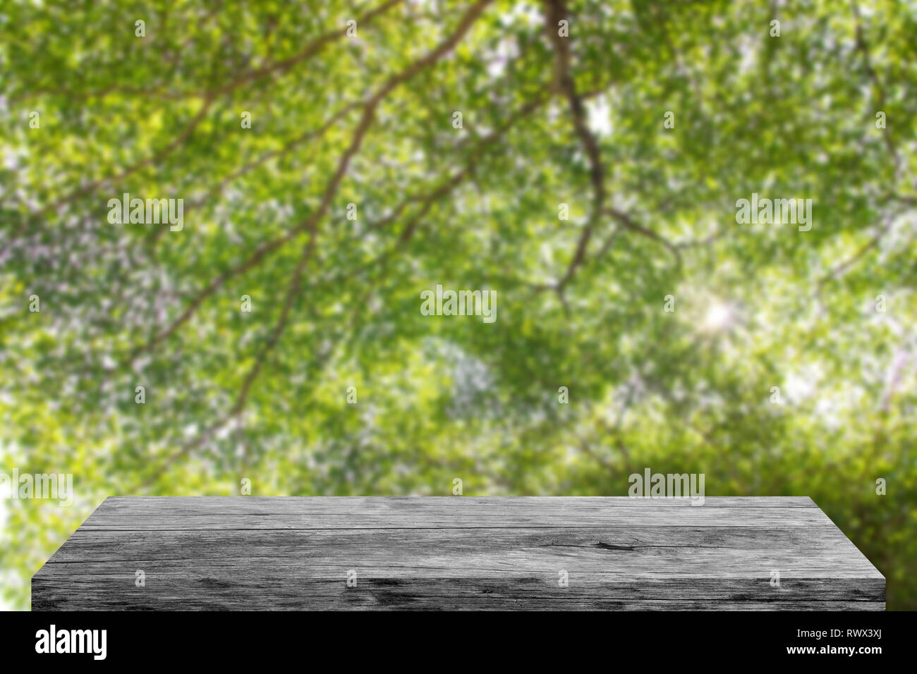 wood table on green nature background Stock Photo - Alamy