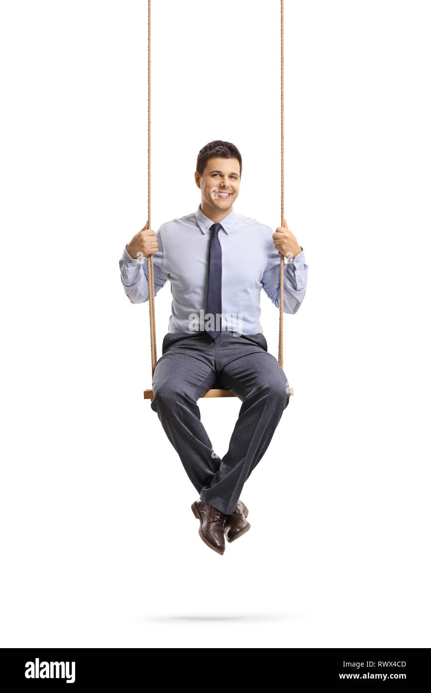 Full length portrait of a young professional man sitting on a swing and ...
