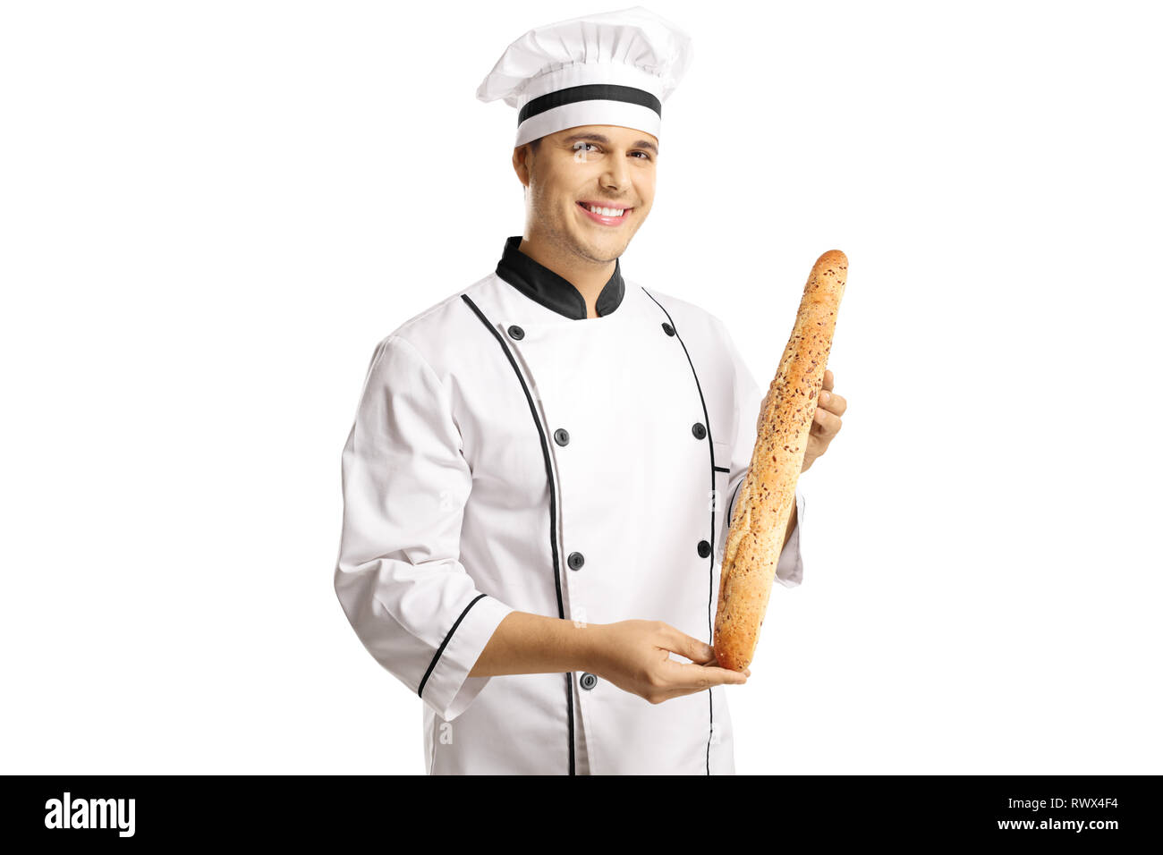 Smiling male chef in a uniform holding a loaf of baguette bread ...