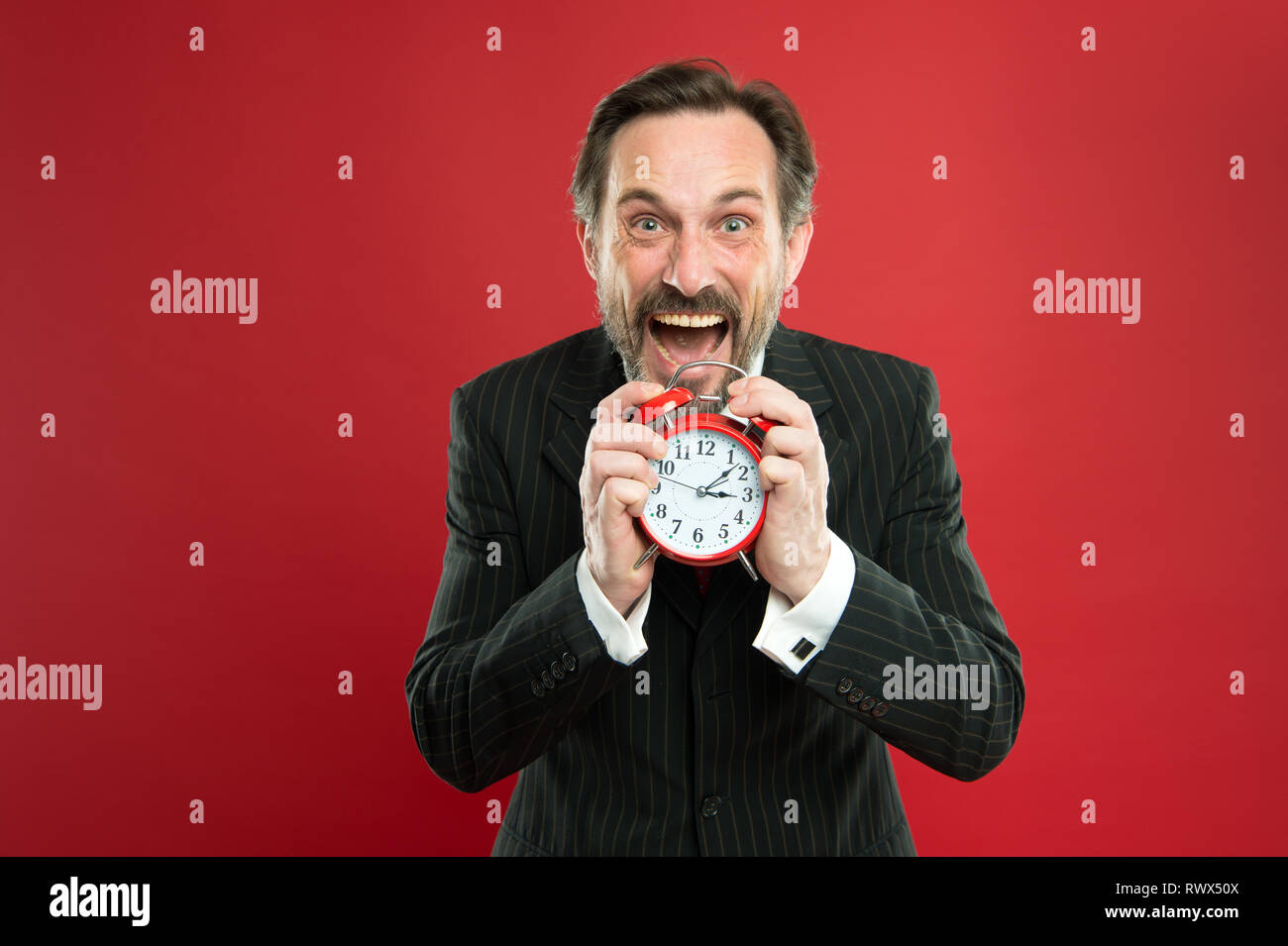 How much time left till deadline. Manager with alarm clock. Man bearded ...