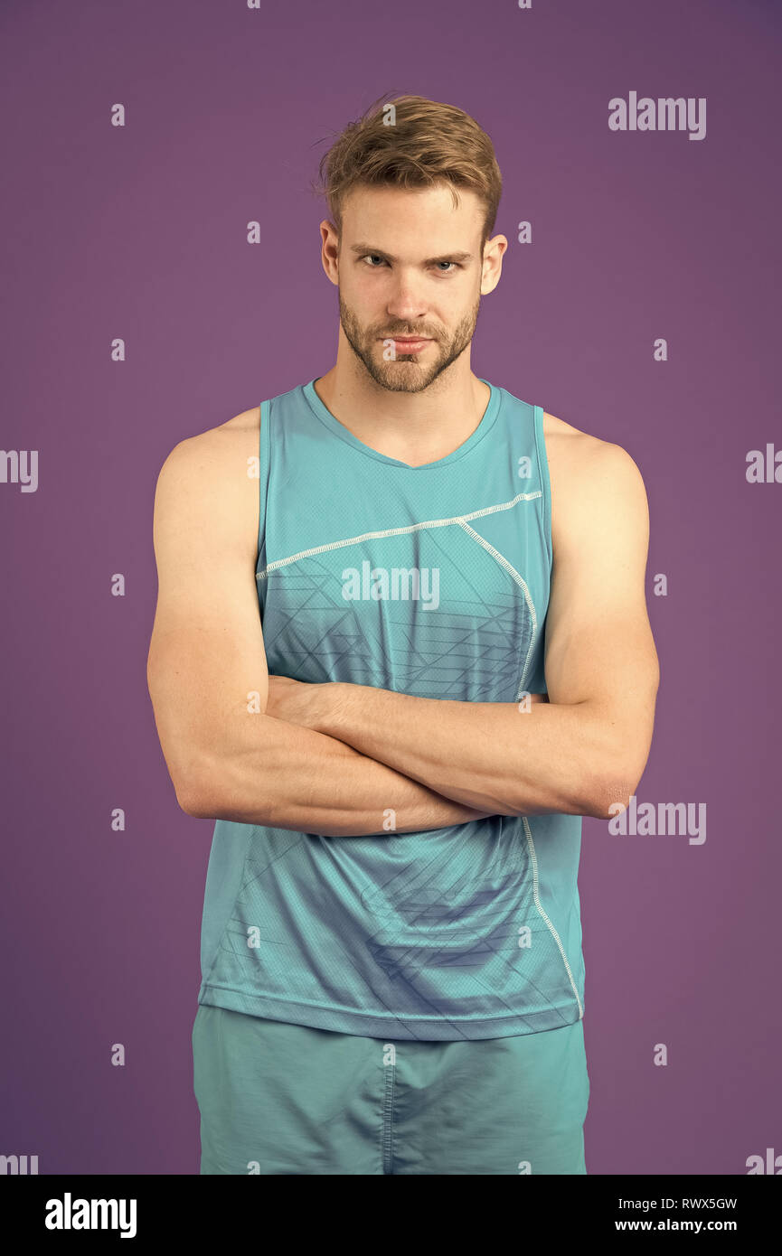 Proud to be strong. Man sporty outfit looks serious and strict with ...