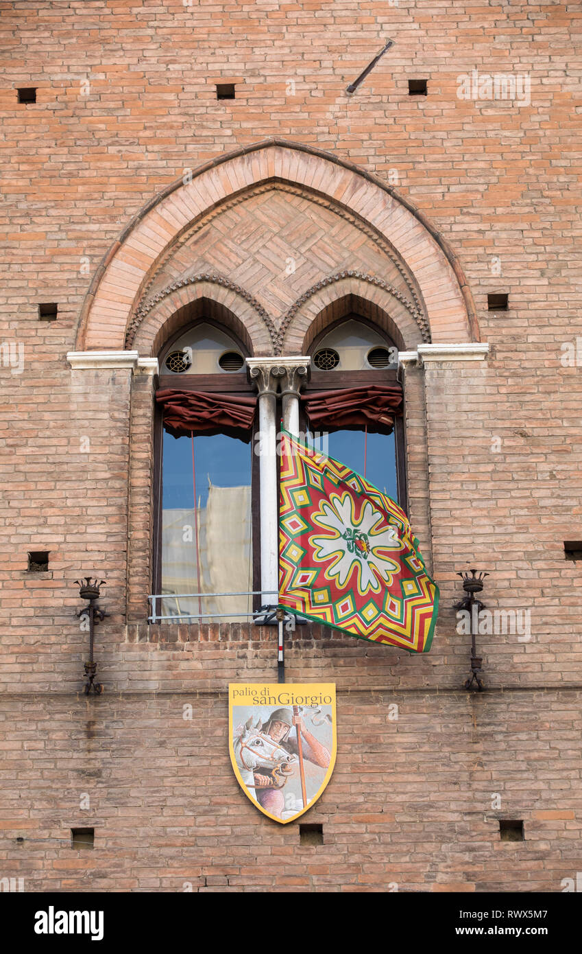 Ferrara, Italy - June 10, 2017: Palio flags and badges. The Palio of St ...