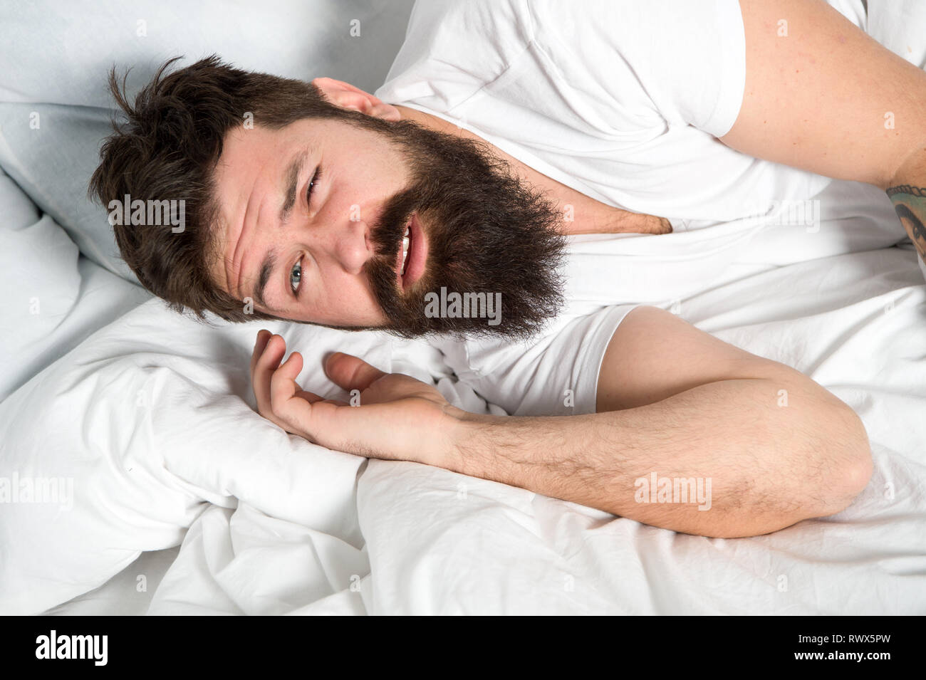 Lazy morning. Relax and sleep concept. Man bearded guy sleep on white ...