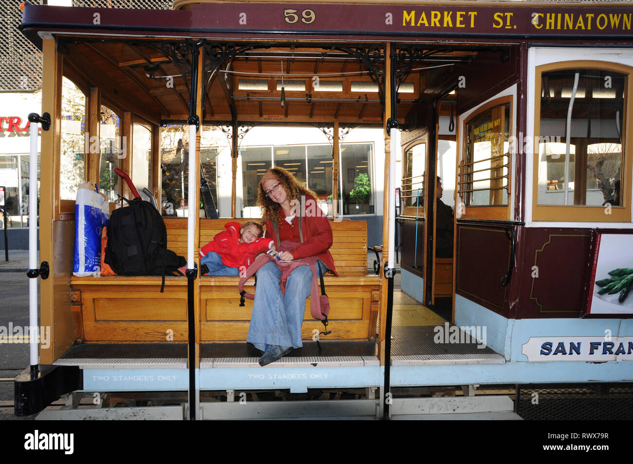 Classic view of historic traditional Cable Cars riding on famous ...