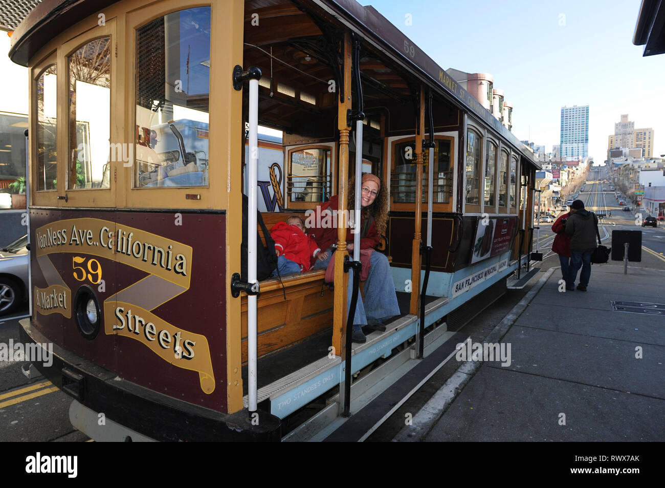 Classic view of historic traditional Cable Cars riding on famous ...