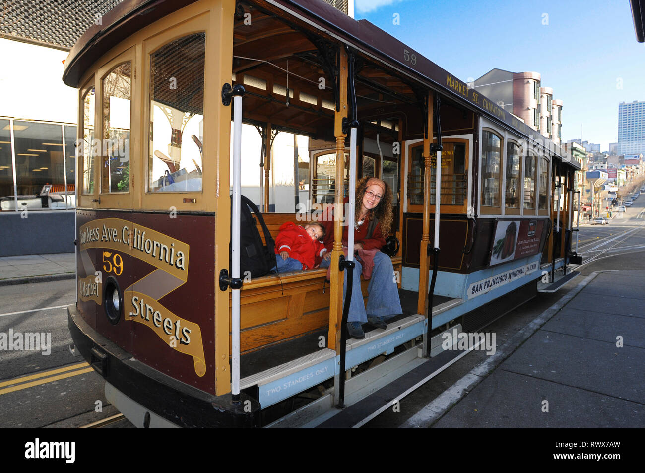 Classic view of historic traditional Cable Cars riding on famous ...