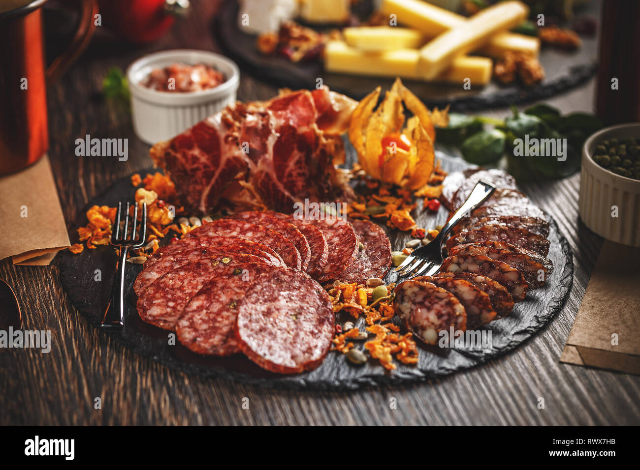 Cold smoked meat plate on a wooden background Stock Photo - Alamy