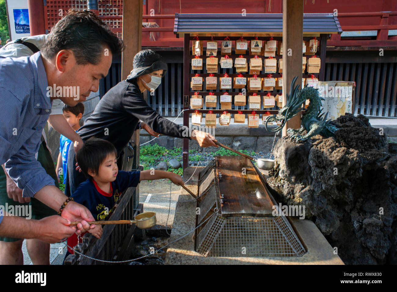 People praying in Toshogu Shrine Temple in Ueno Park in Tokyo, Japan ...