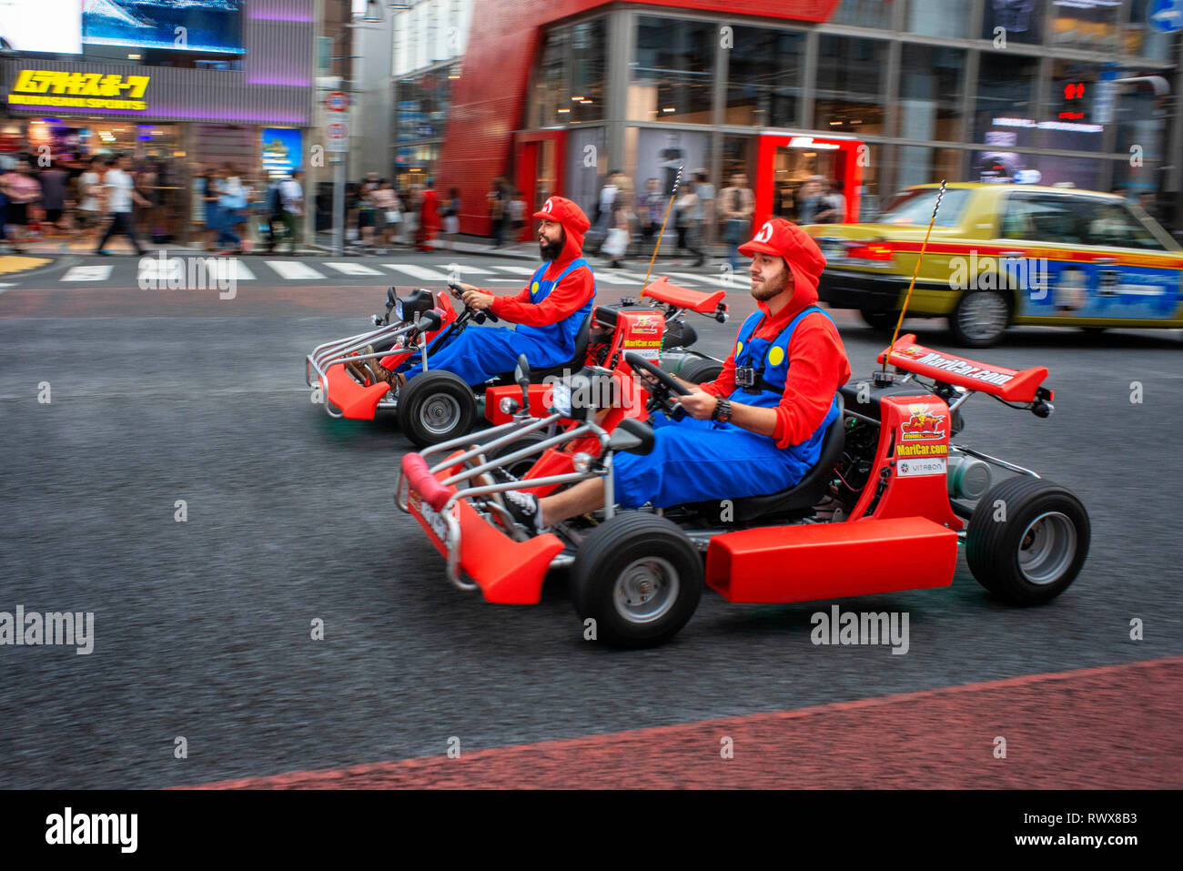 Super Mario Bros carting in the streets of Akihabara district shops in ...