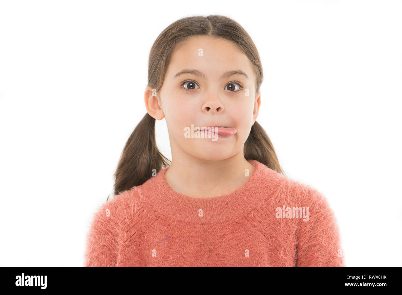 Cute grimace. Girl cute child making funny grimace with tongue ...