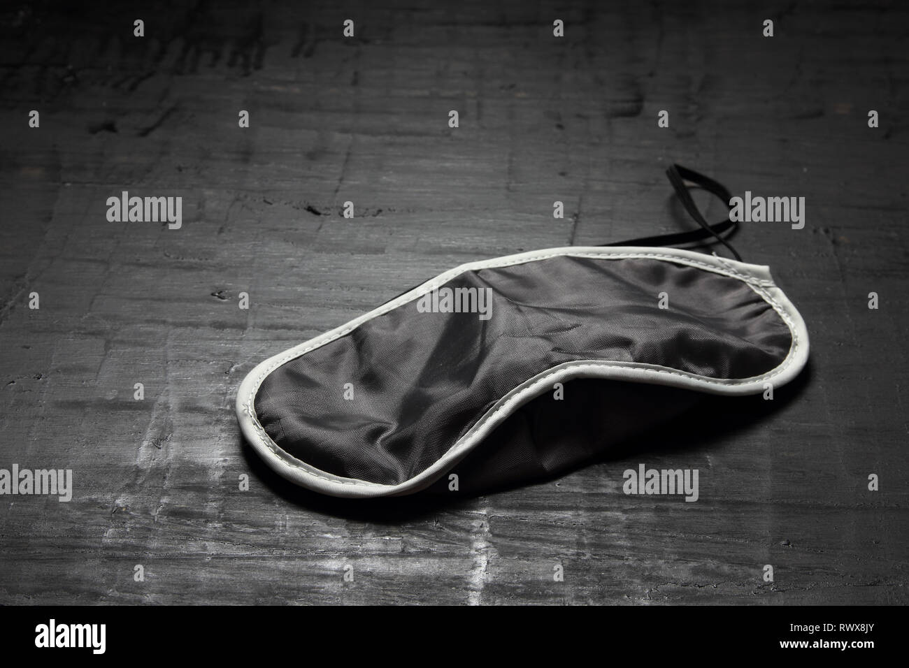 Sleeping Mask on Wooden Background Stock Photo - Alamy