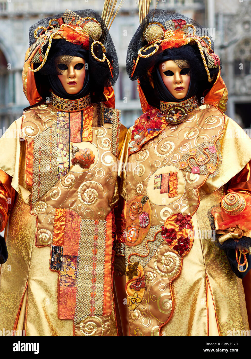 Italy carnival masked costume in gold hi-res stock photography and ...