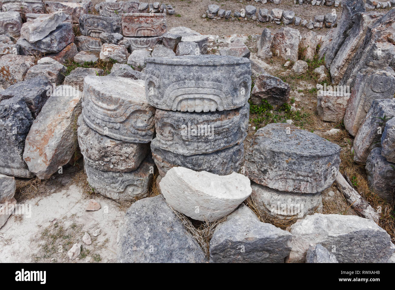 A group of carved Mayan stone objects at the Mayan site of Kabah from ...