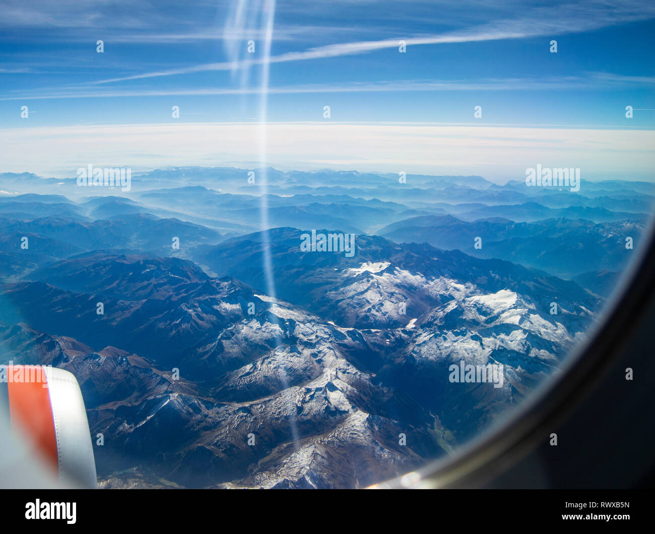 Looking through the window of the plane during the flight to the snow ...
