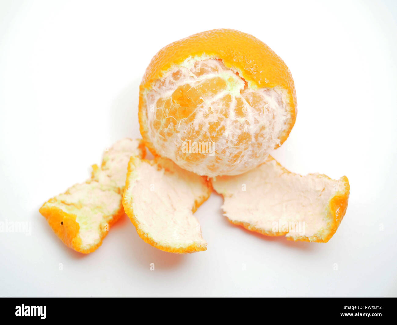 Mandarin is cleared from the skin. Fruit on white background. Still ...