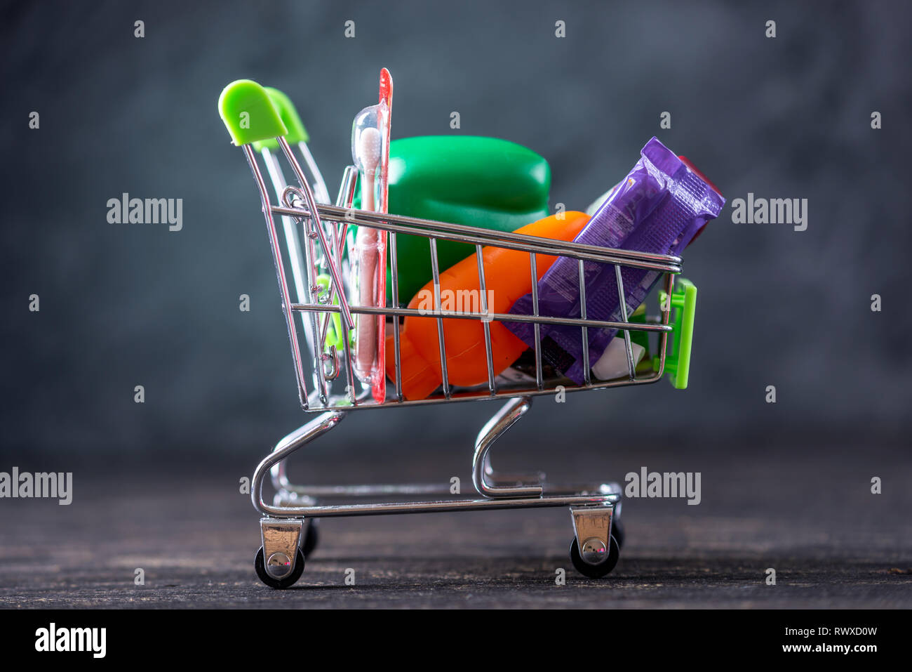Daily purchases in the shopping cart on a dark background. Concept of ...