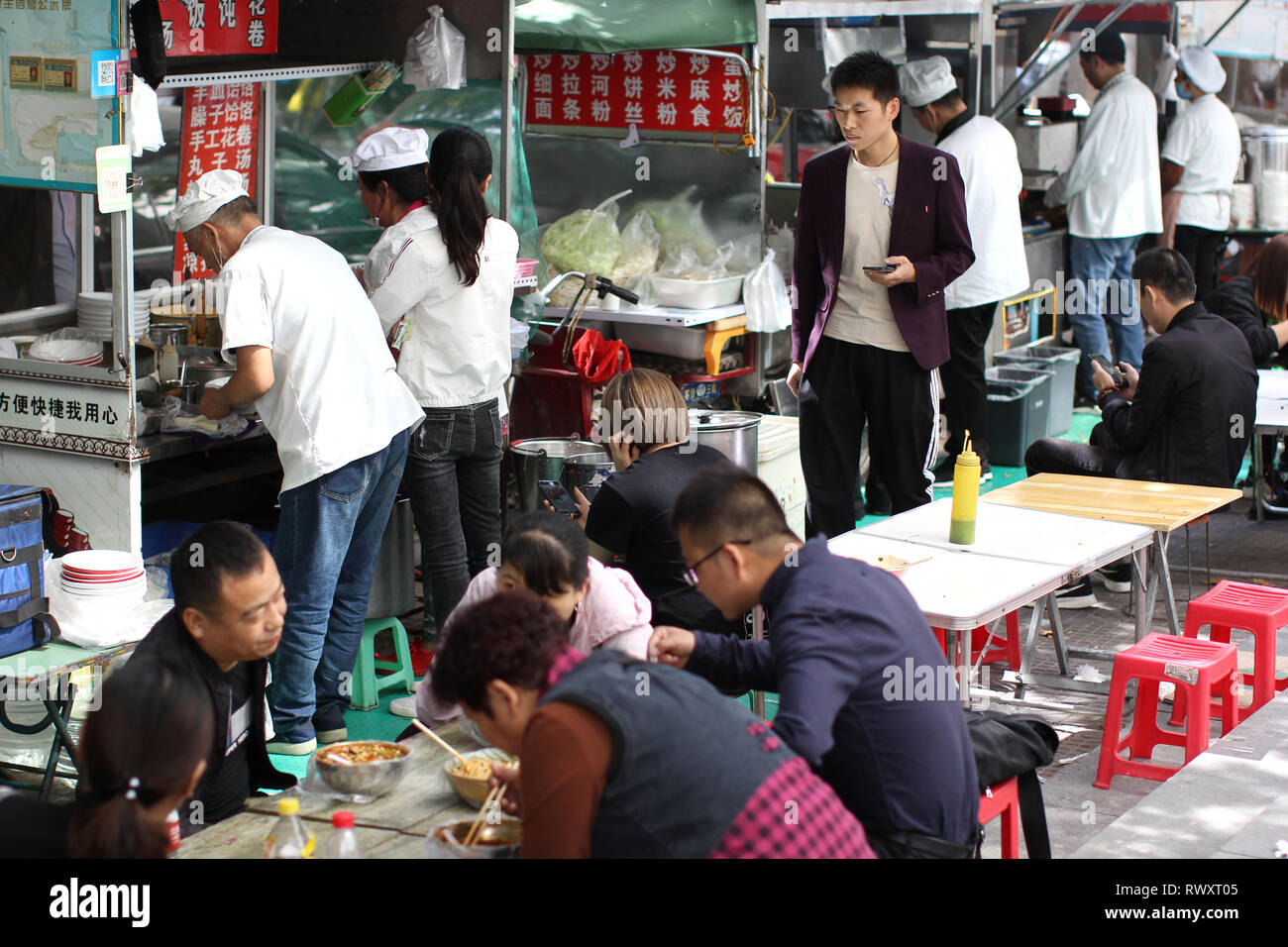 XI'AN, CHINA - OCTOBER 9, 2018: Making chinese street food and people ...