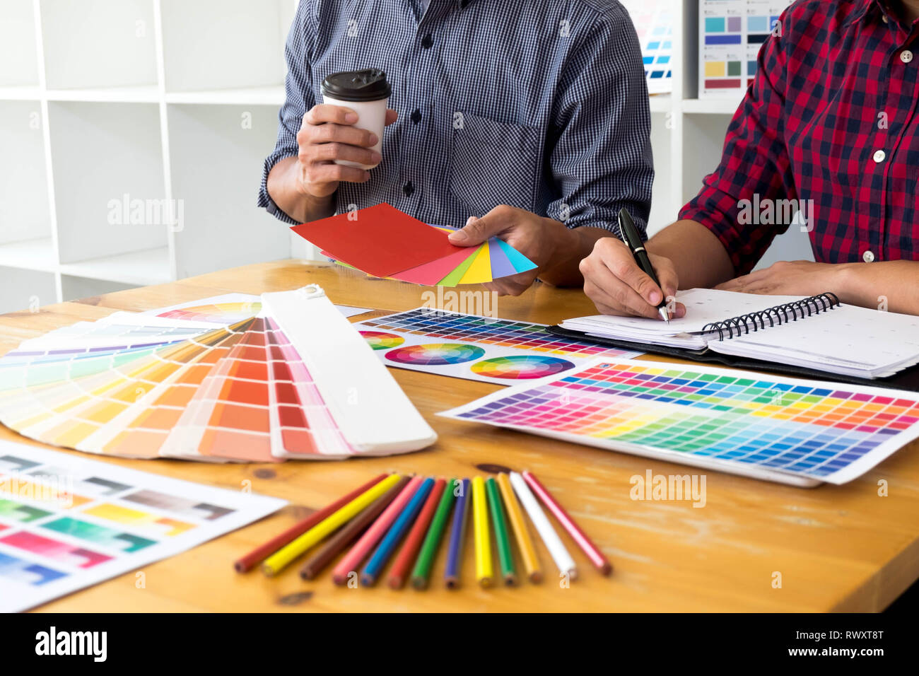 Graphic designers choose colors from the color bands samples for design ...