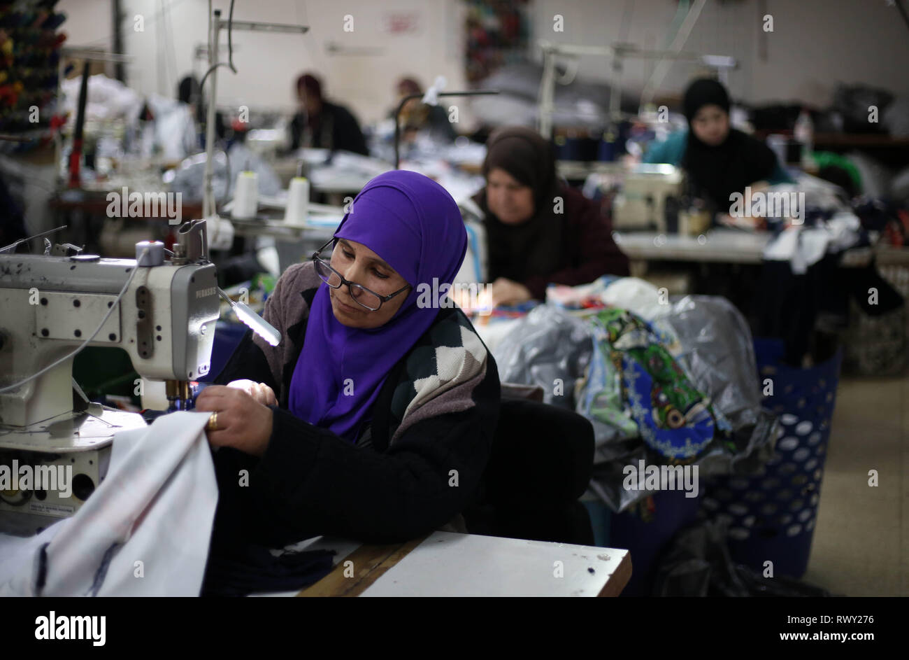 Qalqilya. 7th Mar, 2019. A Palestinian woman works at a clothing ...