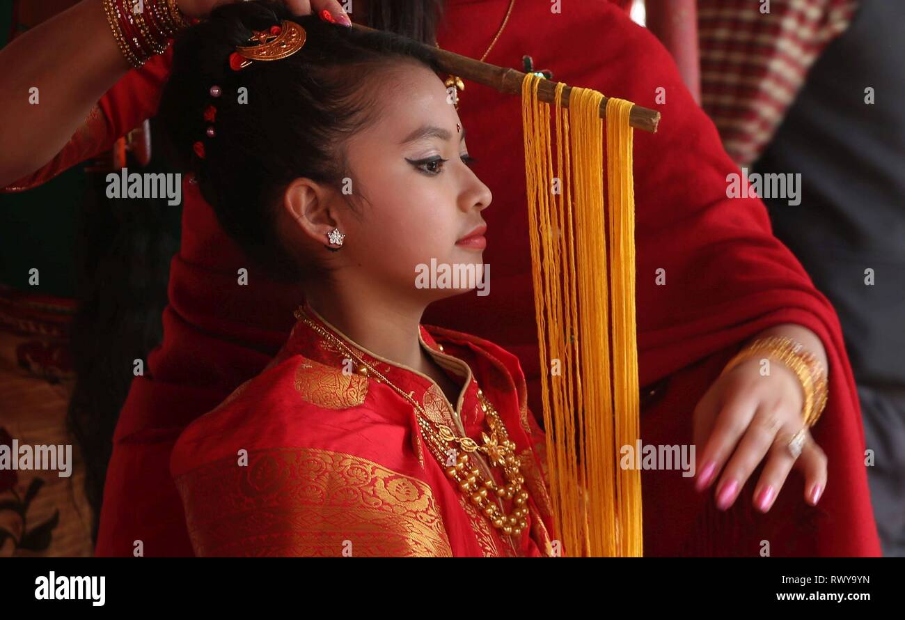 Kathmandu, Nepal. 8th Mar, 2019. A girl from Newar community performs ...