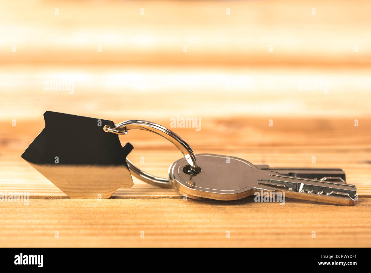 house keys on wood background Stock Photo - Alamy