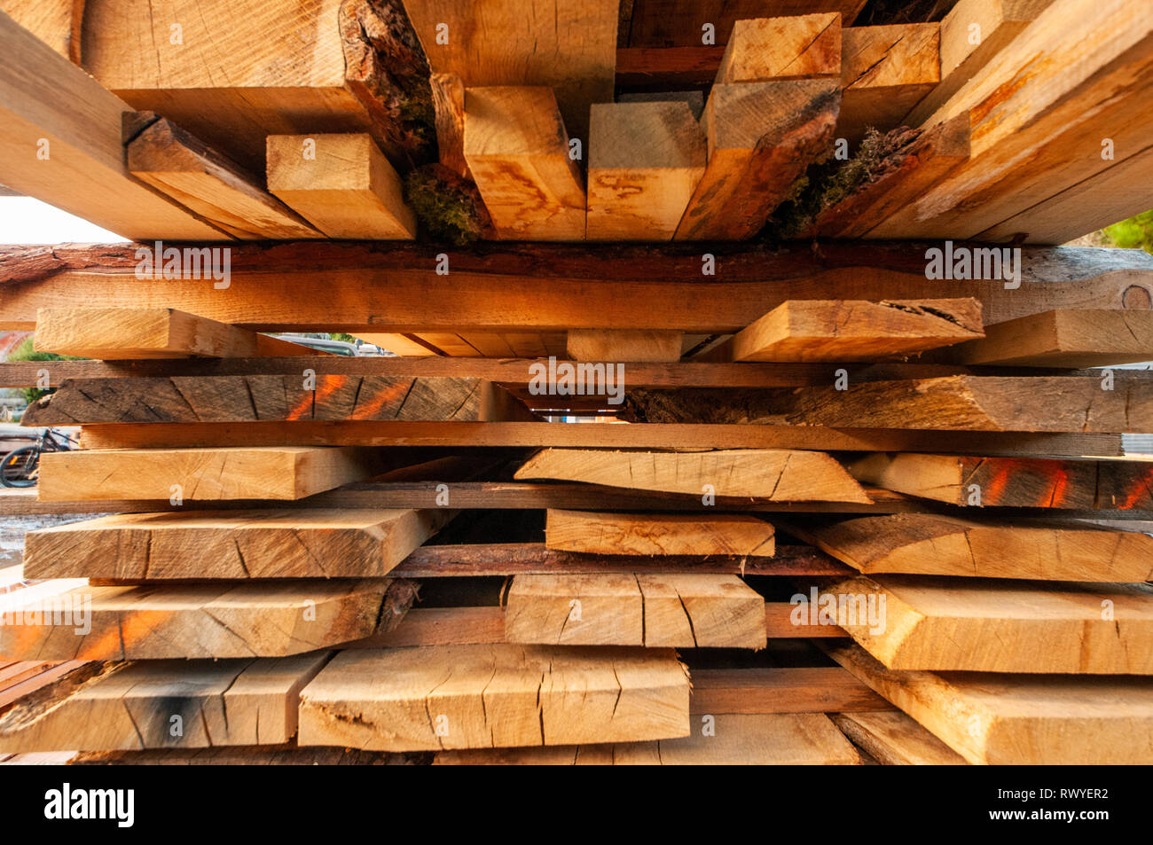 Planks of timber stacked Stock Photo - Alamy
