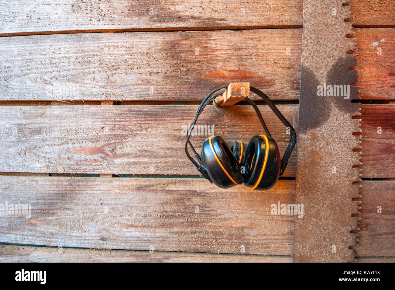 Ear defenders and blade of industrial saw Stock Photo - Alamy