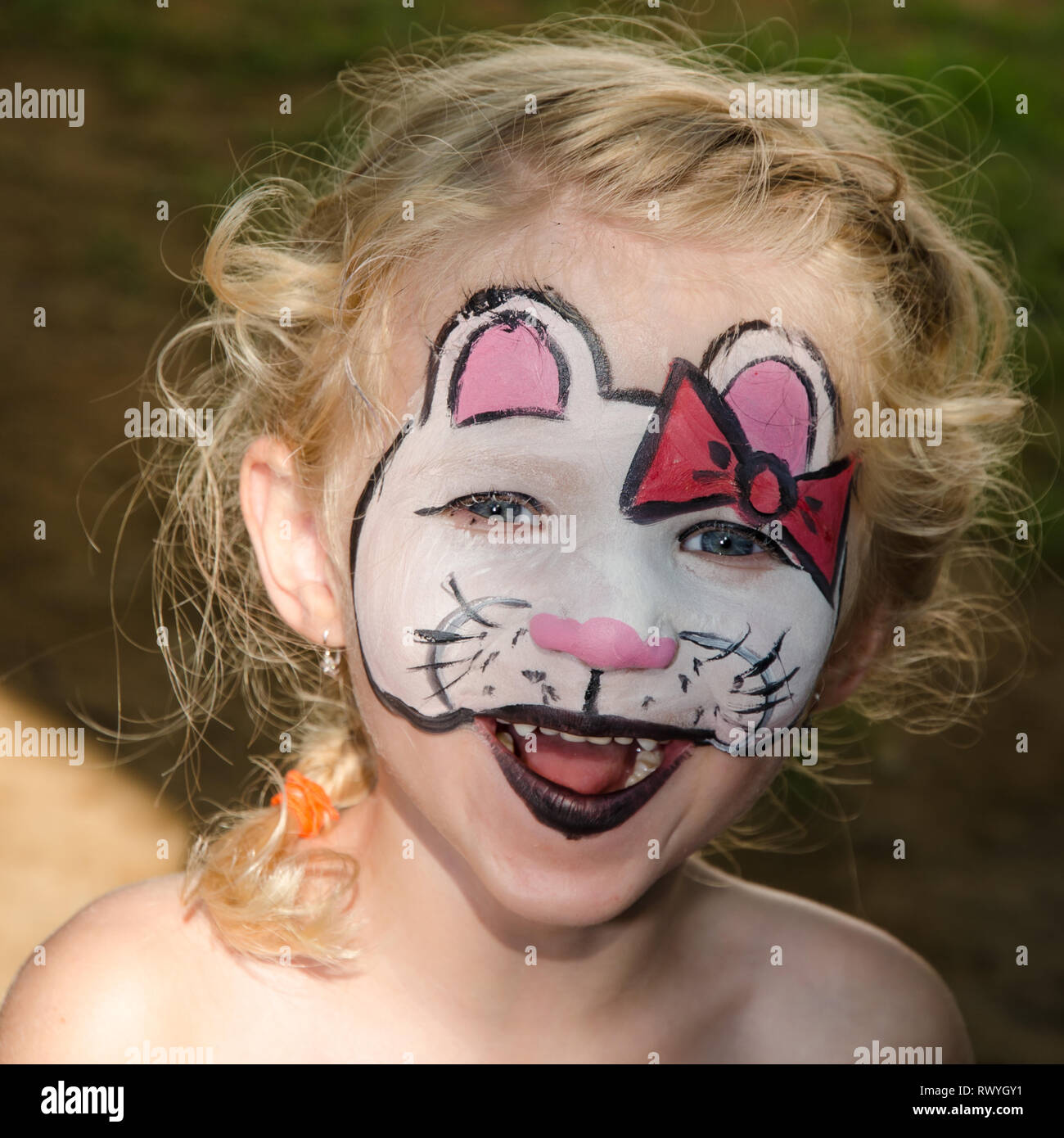 blond girl with cat face painting Stock Photo - Alamy