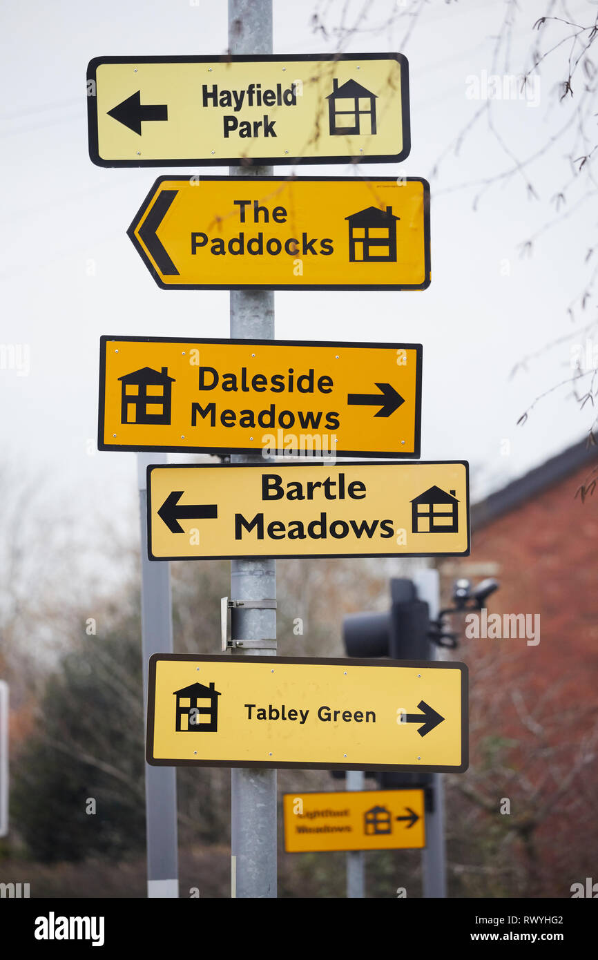 many new build Building housing estate yellow show homes direction ...
